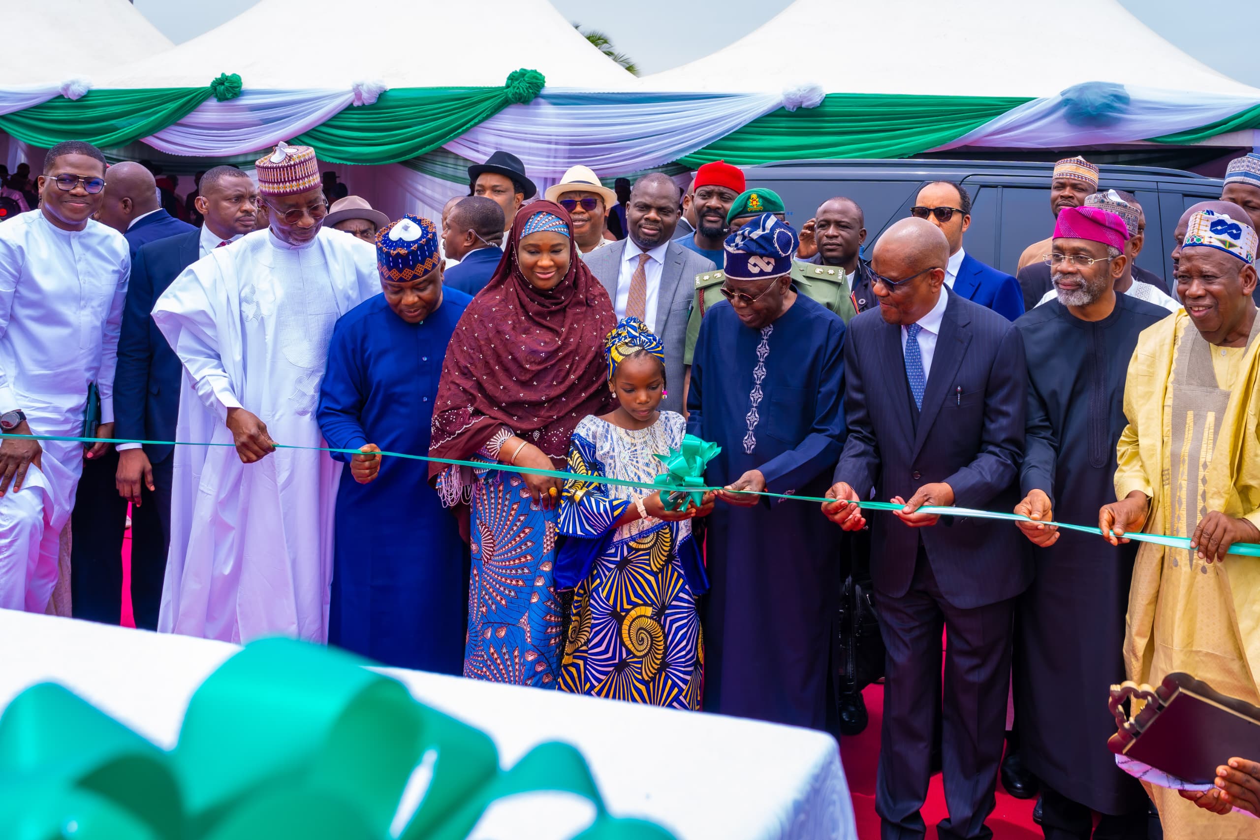 Tinubu inaugurates bridge linking two Abuja districts